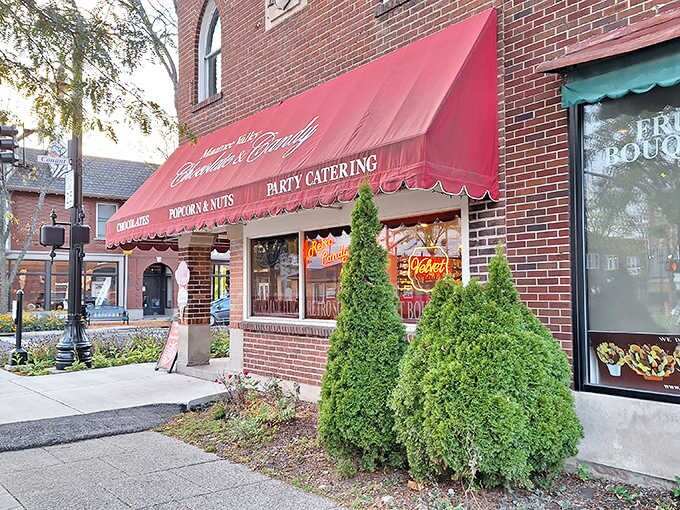 The inviting red awning of Maumee Valley Chocolate and Candy beckons sweet-toothed time travelers into this brick-fronted paradise of sugary nostalgia.