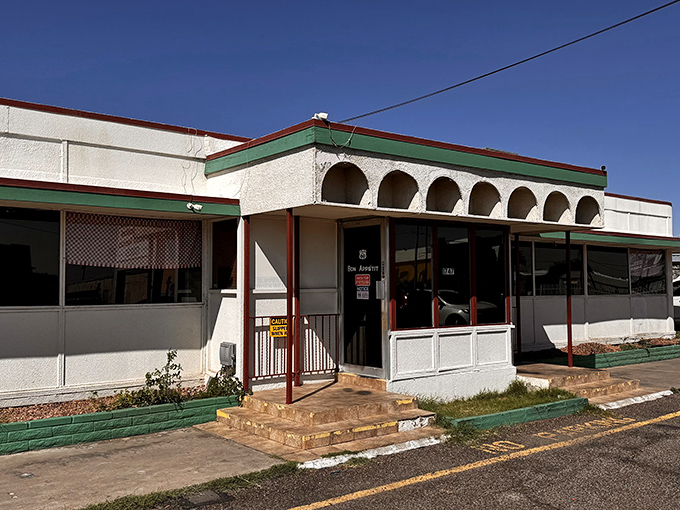 Mel's Diner: Where that iconic white building with green trim promises comfort food nirvana under the brilliant Arizona sky.