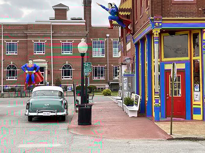 Metropolis welcomes visitors with its iconic Superman statue standing tall against the brick buildings, creating a surreal small-town superhero vibe.