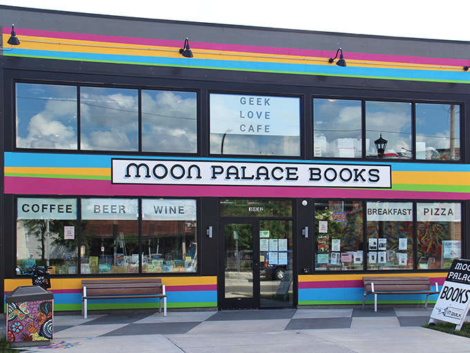 Rainbow stripes welcome literary adventurers to Moon Palace Books, where the exterior promises the colorful experiences waiting inside.