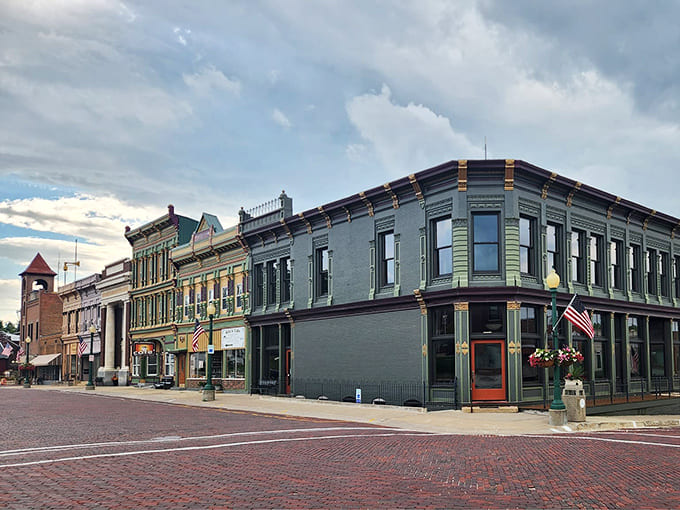 Mount Carroll's downtown rises against a perfect Midwest sky, proof that small towns can pack serious architectural punch.