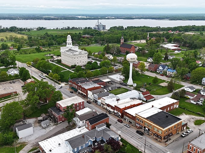 Aerial view of Nauvoo showcasing the magnificent temple, historic district, and Mississippi River backdrop &ndash; small-town charm with big-time views!