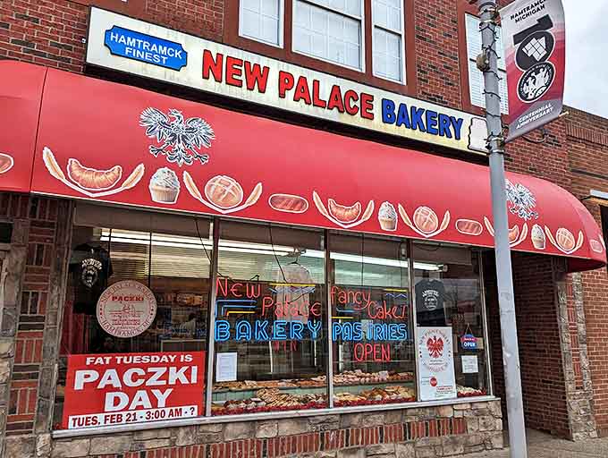 The iconic red awning of New Palace Bakery beckons sweet-toothed pilgrims to Hamtramck's Polish pastry paradise, where donut dreams come true.