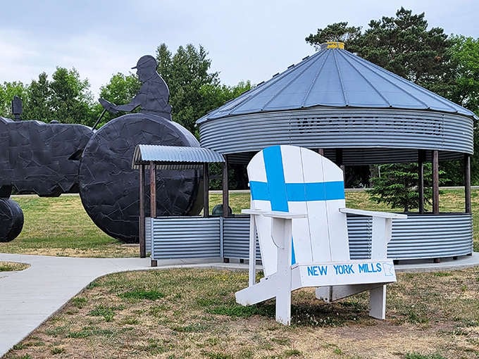 The iconic farmer silhouette and grain bin gazebo welcome visitors to New York Mills Sculpture Park, where rural charm meets artistic vision.