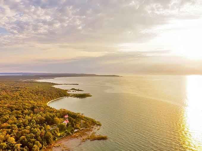 Golden hour transforms Northport's coastline into a painter's dream, where forest meets water in a perfect Michigan embrace.
