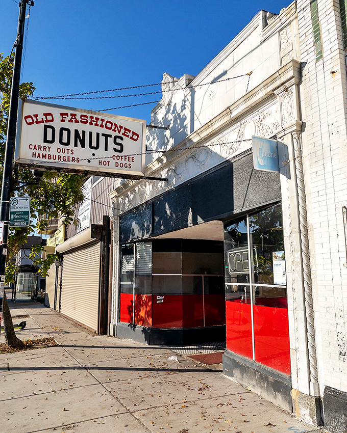 The iconic Old Fashioned Donuts sign beckons from Michigan Avenue, promising sweet treasures within this South Side Chicago institution.