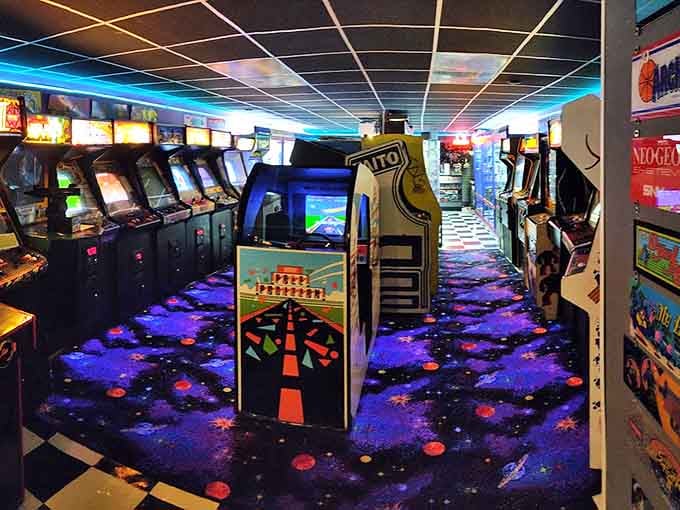 Step into a galaxy of nostalgia at Out of This World Arcade, where the cosmic carpet and glowing cabinets transport you straight to gaming's golden age.