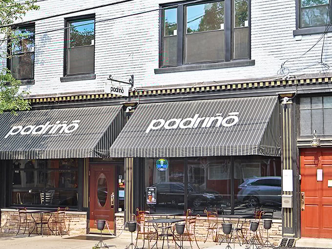Padrino's welcoming storefront beckons with its distinctive black awnings and charming outdoor seating &ndash; a little slice of Italy nestled in Milford's heart.