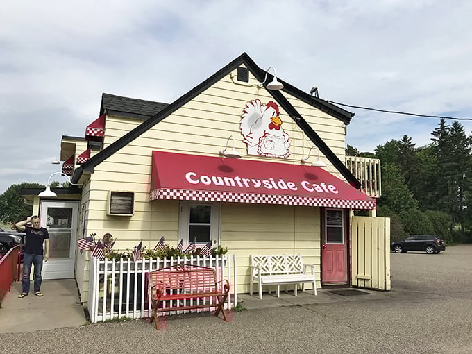 The cheerful yellow exterior with its iconic red awning welcomes hungry travelers like a beacon of breakfast hope.
