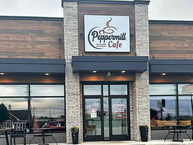 The welcoming facade of Peppermill Cafe stands ready to transform ordinary mornings into extraordinary memories. Brick and wood combine for that perfect neighborhood vibe.