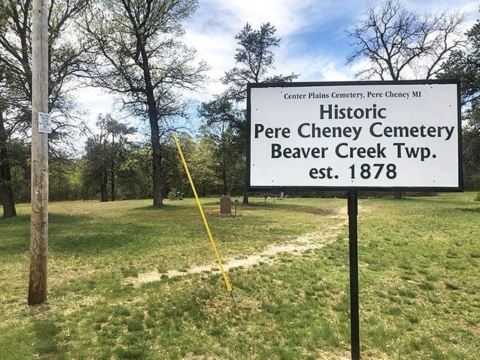 Welcome to the afterlife of a Michigan lumber town &ndash; Pere Cheney Cemetery's weathered sign stands as the last official greeter to this ghost town.
