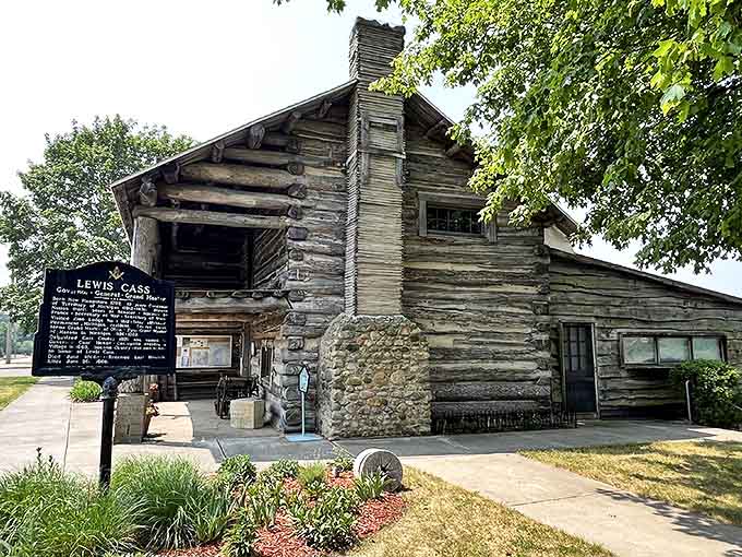 The weathered logs of the Pioneer Log Cabin Museum stand as a testament to craftsmanship that's outlasted generations of Michigan winters.