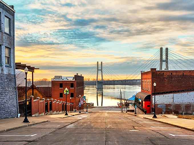 Quincy's sloping streets lead to breathtaking Mississippi River views, where the bridge stretches across water like a steel ribbon connecting two states.