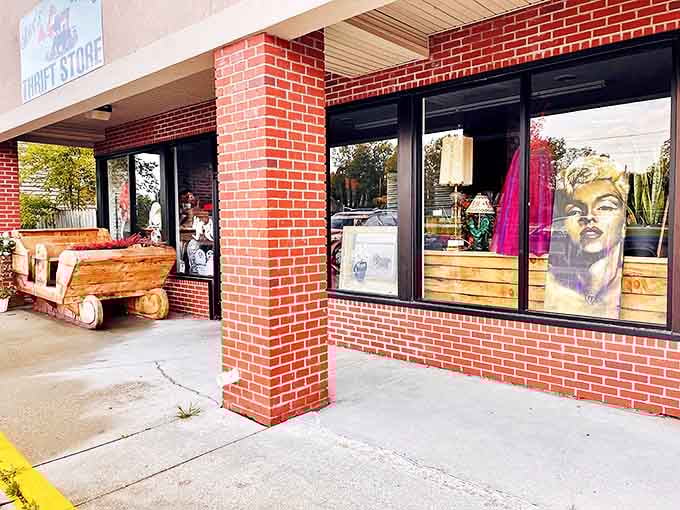 The welcoming facade of Rae's Retro Thrift Store, complete with handcrafted log bench &ndash; like a rustic time machine waiting for curious travelers.