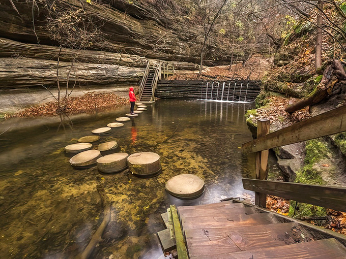 Nature's stepping stones invite adventurous souls across the gentle stream, leading to hidden wonders beyond the canyon walls.