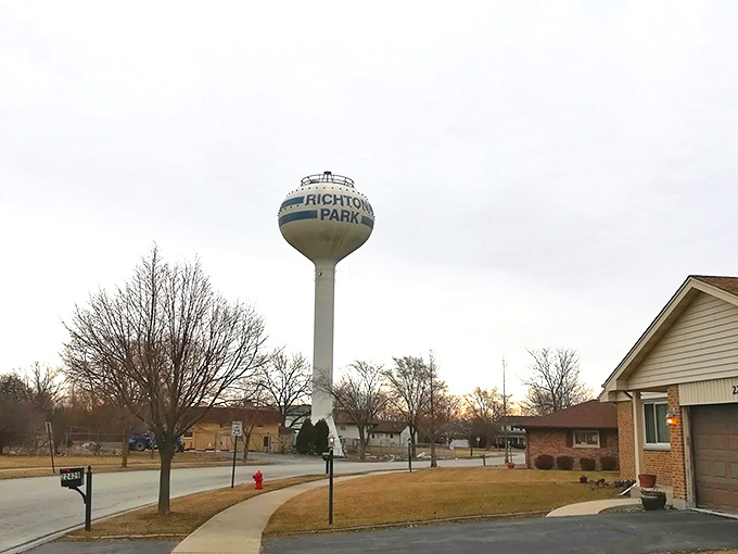 Richton Park's iconic water tower stands sentinel over quiet streets, a beacon of small-town tranquility just a short drive from Chicago's chaos.