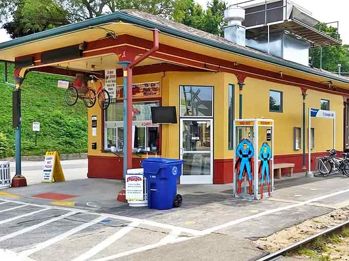 The historic yellow train depot now houses Silver Beach Pizza, where Superman phone booths stand guard and culinary adventures await.