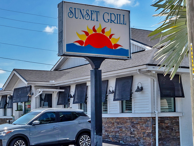 The iconic Sunset Grill sign promises Florida charm and coastal comfort food &ndash; a beacon for hungry travelers seeking authentic local flavor.
