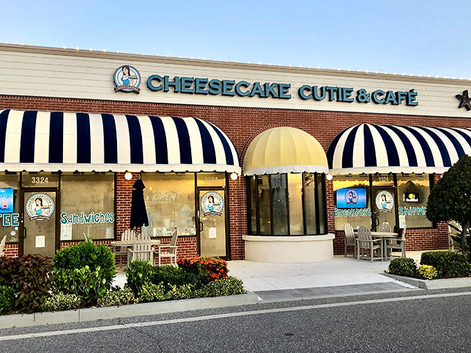 The inviting storefront of Cheesecake Cutie & Caf&eacute; beckons with its cheerful blue-striped awnings and warm brick fa&ccedil;ade &ndash; Naples' sweetest welcome committee.