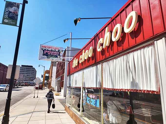 The iconic red exterior of The Choo Choo stands out like a cheerful time capsule on Miner Street, promising delicious nostalgia inside.