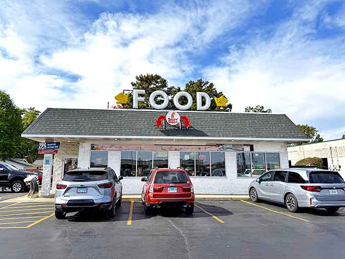 The iconic Cozy Dog Drive In exterior stands proudly along Route 66, its vintage sign beckoning travelers with the promise of nostalgic delights.