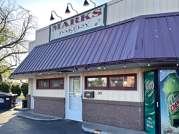 The unassuming exterior of Marks Bakery with its distinctive purple awning belies the sweet treasures waiting inside this Lemont institution.