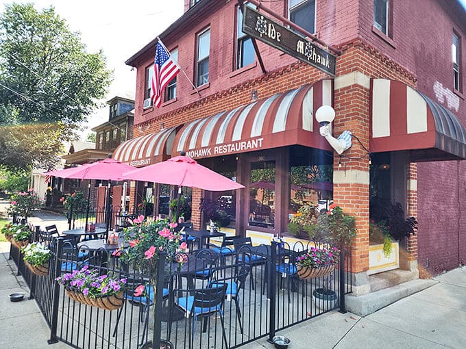 The Old Mohawk's charming brick exterior with striped awnings invites passersby into a world where comfort food reigns supreme in Columbus' German Village.