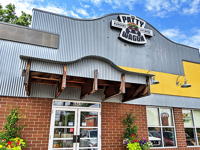 The Patty Wagon's distinctive corrugated metal exterior stands out on Nicollet Avenue, promising burger bliss within those brick-and-metal walls.