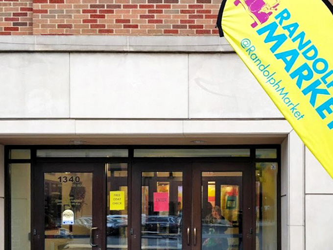 The vibrant yellow banner welcomes treasure hunters to Chicago's Randolph Street Market, promising vintage delights and unexpected discoveries inside.