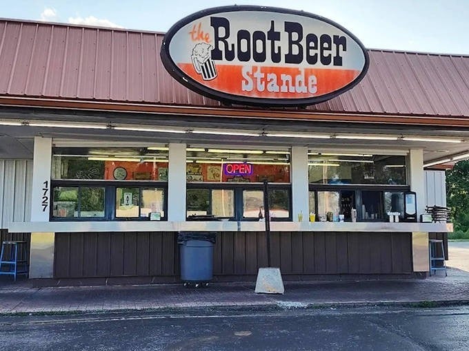 The iconic oval sign of The Root Beer Stande beckons with retro charm, promising frosty mugs and nostalgic flavors that transport you back in time.