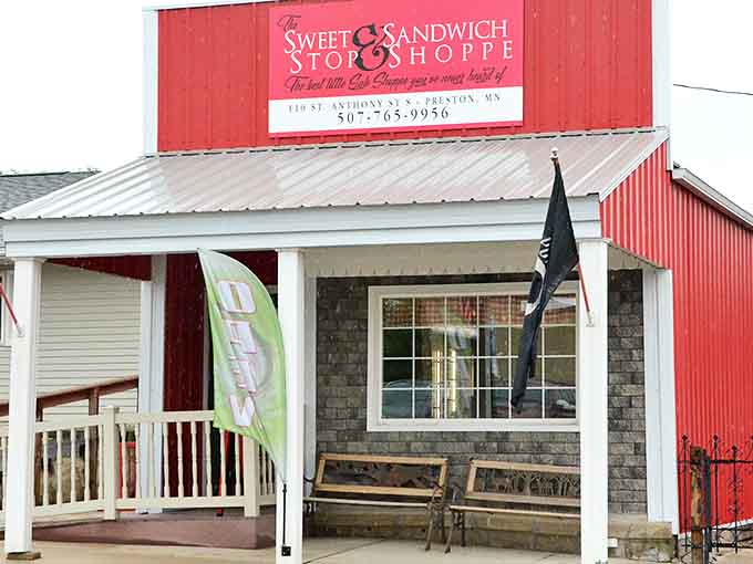 The bright red exterior of The Sweet Stop and Sandwich Shoppe stands out in Preston like a culinary beacon, promising delicious treasures within.