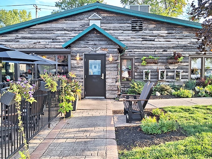 The Whitehouse Inn: Weathered logs and teal trim create a rustic welcome that promises comfort food paradise within these historic walls.