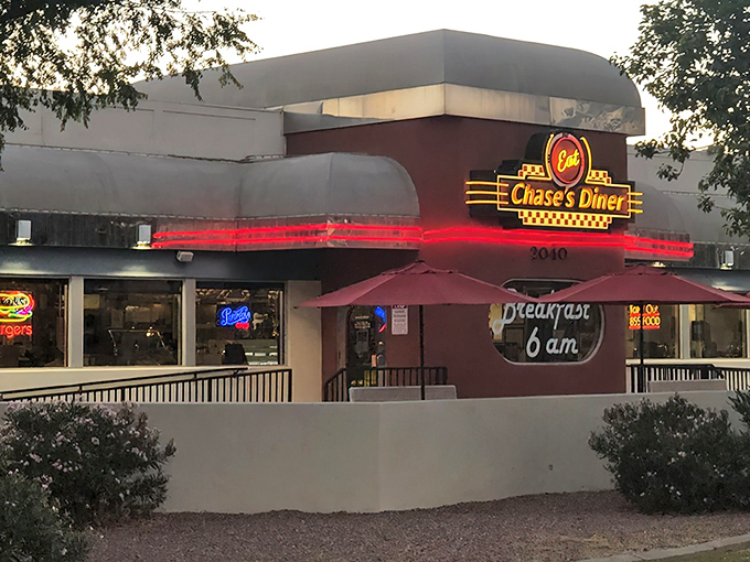 The neon glow of Chase's Diner beckons like a lighthouse for the hungry, promising comfort and nostalgia at 3040 in Chandler.