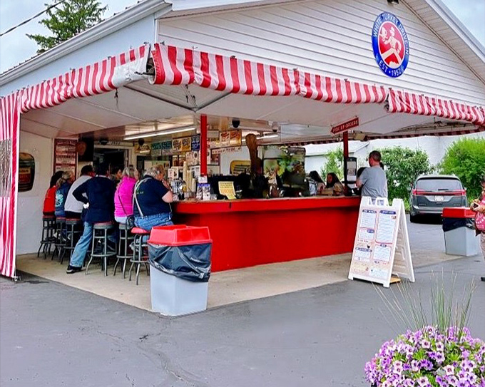 Classic Americana at its finest: White Turkey Drive-In's iconic red and white striped awning welcomes hungry travelers to a slice of the 1950s.
