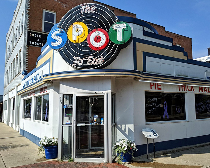 The iconic neon sign of The Spot Restaurant glows like a beacon of nostalgia in downtown Sidney, Ohio.