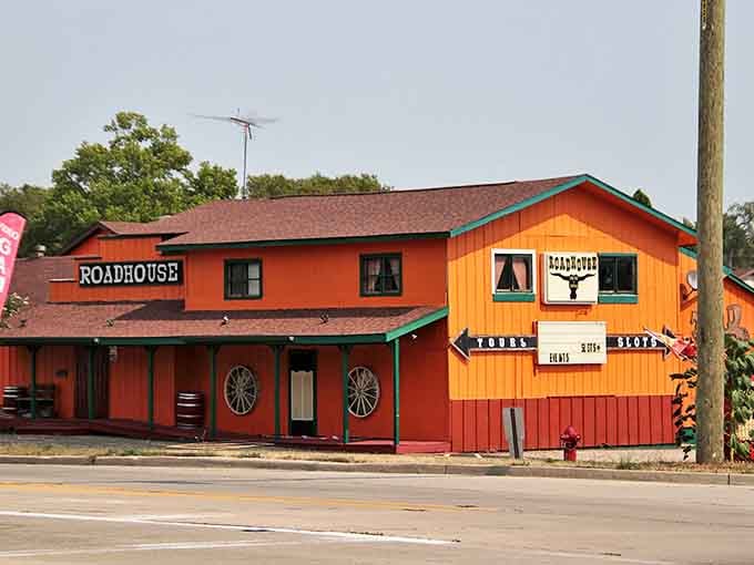 The bright orange exterior of The Road House stands out like a beacon for hungry travelers&mdash;and possibly restless spirits looking for their next haunt.