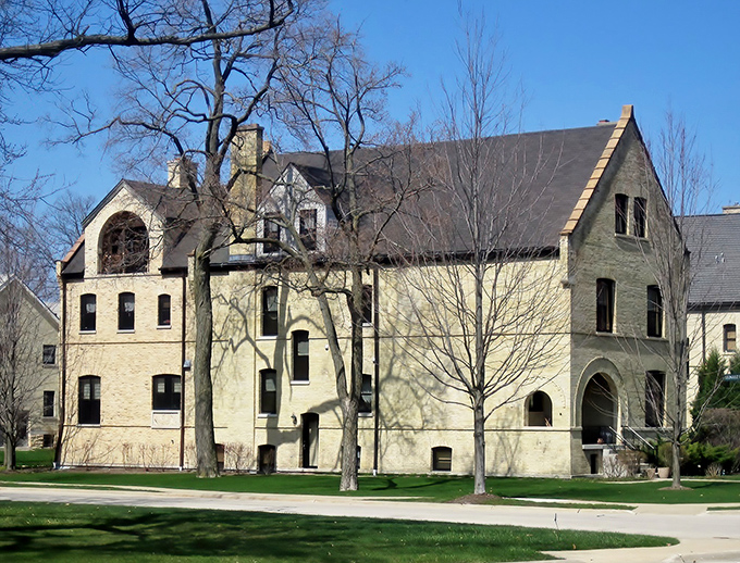 Fort Sheridan's historic limestone buildings stand as elegant sentinels of military history, their warm hues glowing against the Illinois sky.