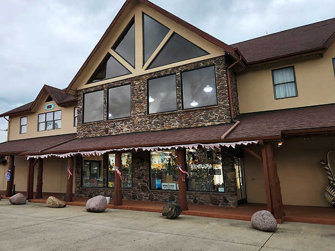 The stone-and-timber fa&ccedil;ade of Driftstone Pueblo stands like a frontier trading post that time forgot, promising treasures within its rustic walls.