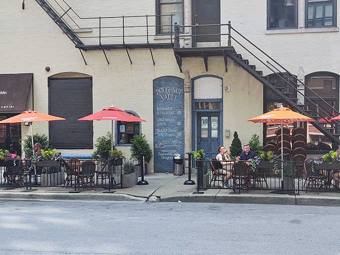 The iconic blue door and charming exterior of Doughnut Vault beckons sweet-toothed pilgrims with promises of fried perfection and zero regrets.