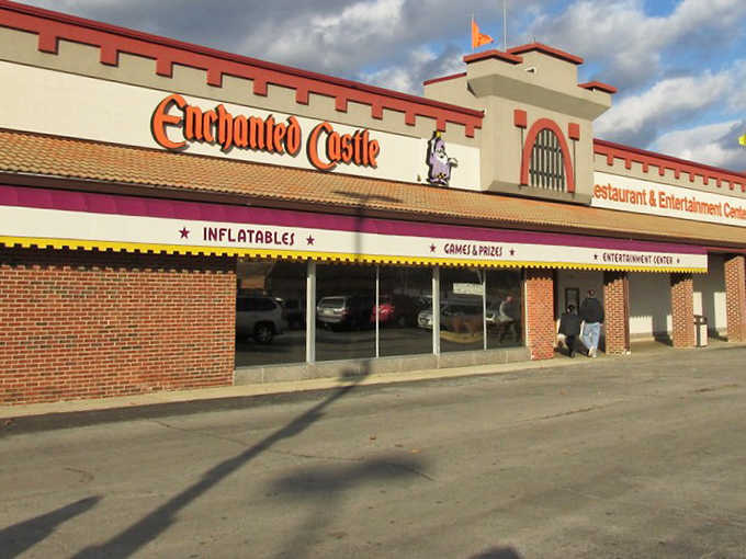 The Enchanted Castle's medieval facade stands proudly in Lombard, promising adventure within its brick walls and neon-lit windows.