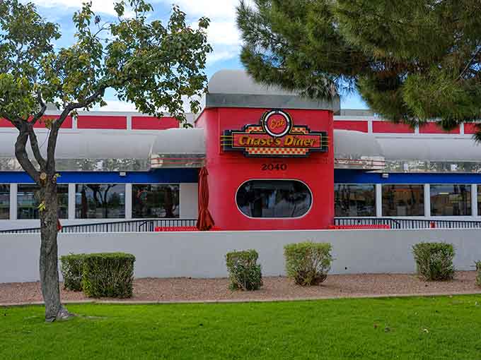 That cherry-red exterior isn't just paint, it's a promise that something special awaits inside this Chandler time machine.