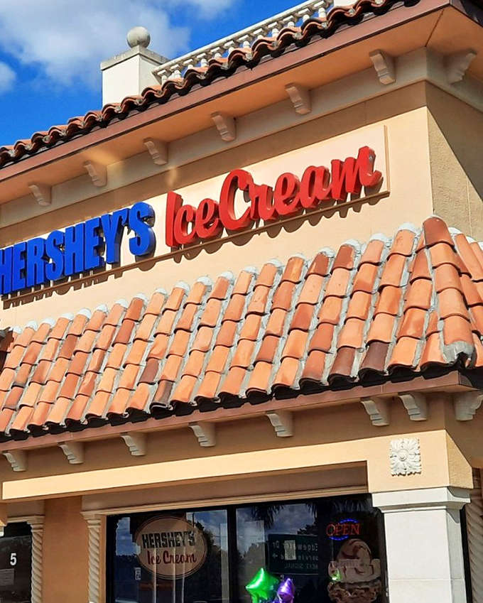 That terracotta tile roof and cheerful red lettering practically shout "happiness lives here," making this strip mall spot impossible to miss when you're hunting for frozen joy.