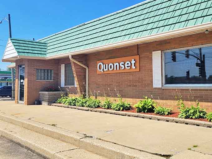 The iconic brick exterior with its distinctive green roof has welcomed pizza lovers to Quonset since 1946, standing as a Waukegan landmark through decades of change.