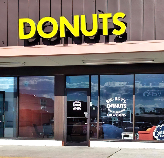 That bright yellow "DONUTS" sign isn't just advertising – it's a beacon of hope for breakfast enthusiasts everywhere.
