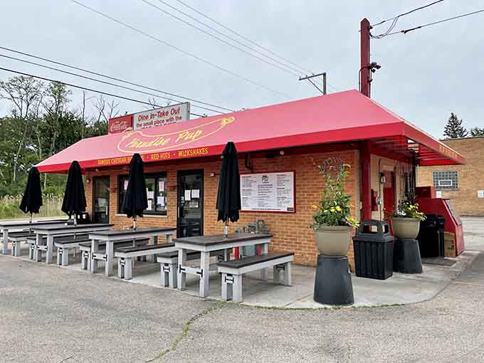 That cheerful red awning beckons like a beacon of burger bliss, promising char-grilled happiness to all who approach this Des Plaines treasure.