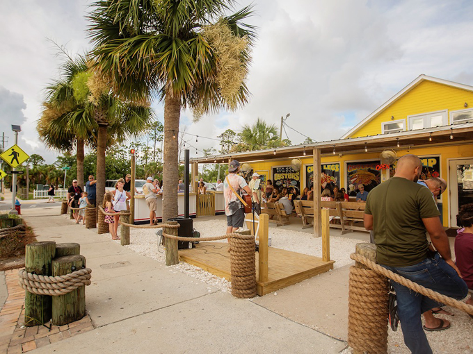The sunshine-yellow exterior of Hunt's Oyster Bar stands as a cheerful beacon in Panama City, promising fresh seafood treasures within its humble walls.