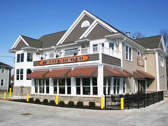 That cheerful exterior isn't trying to win architecture awards, just your heart and stomach with decades of hot dog excellence.