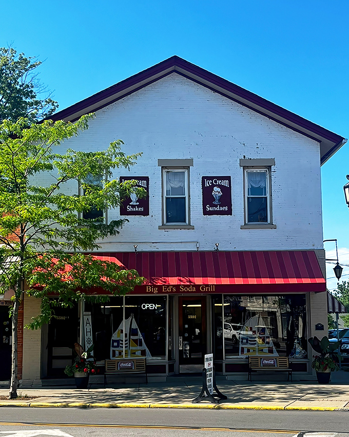Classic Americana stands proud on Liberty Avenue&mdash;white brick, red awning, and promises of ice cream that'll make your day.