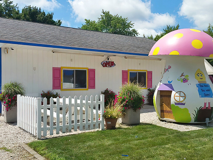 Exterior: A storybook come to life &ndash; white building with pink shutters and yellow frames, where every detail whispers "childhood magic awaits inside."