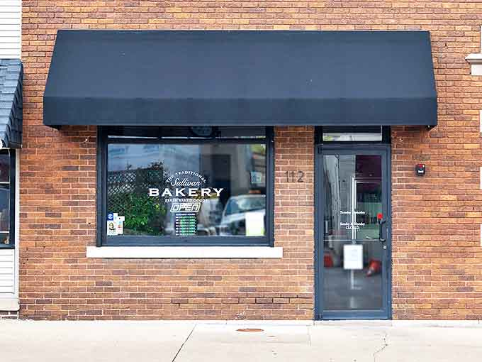 The unassuming brick fa&ccedil;ade of Traditional Sullivan Bakery hides a wonderland of treats behind its modest black awning and simple signage.